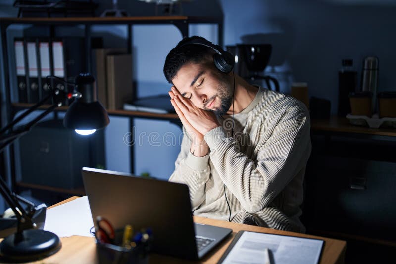 Young Handsome Man Working Using Computer Laptop at Night Sleeping ...