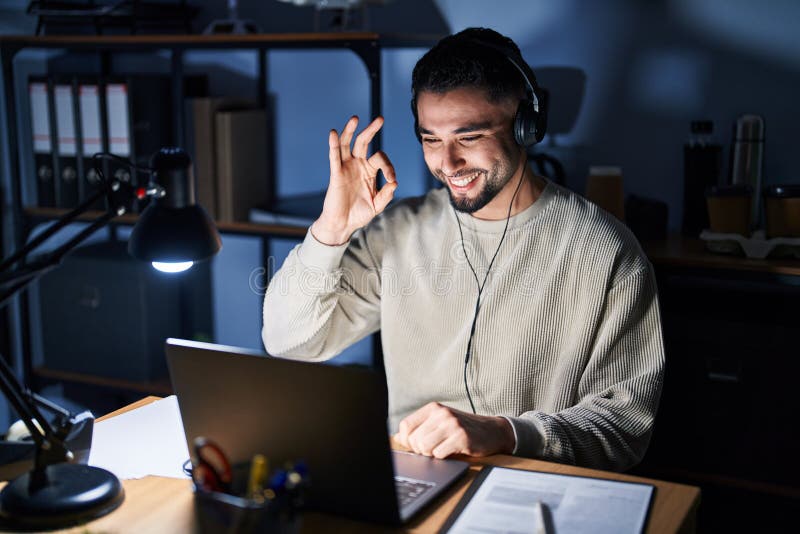 Young Handsome Man Working Using Computer Laptop at Night Smiling ...