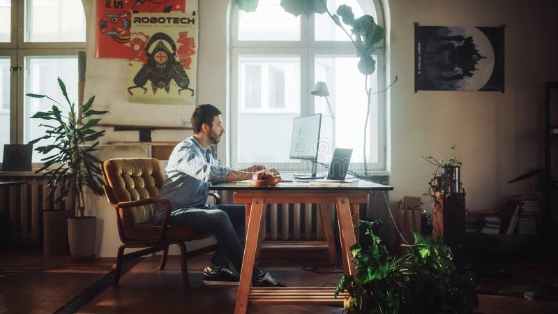 Young Handsome Man Works on a Desktop Computer in Creative Agency in ...