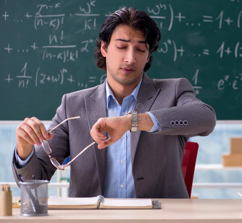 Young Handsome Math Teacher in Classroom Stock Photo - Image of ...