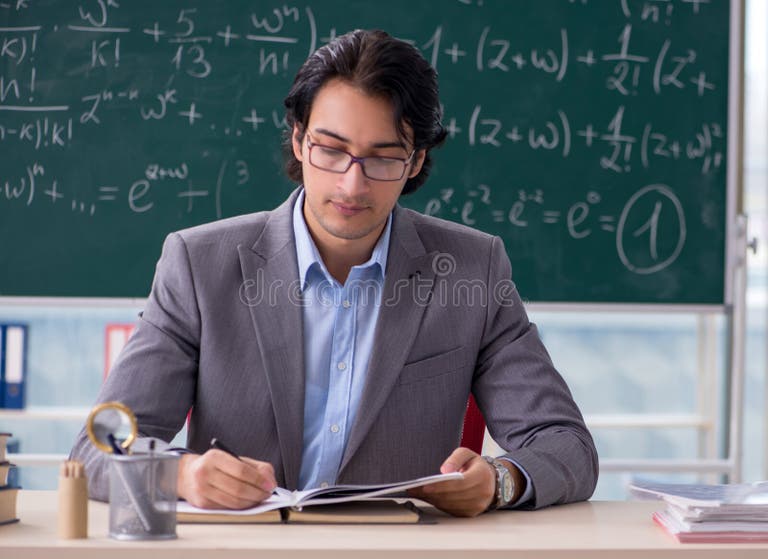 Young Handsome Math Teacher in Classroom Stock Image - Image of ...