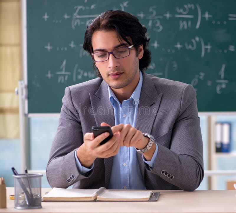 Young Handsome Math Teacher in Classroom Stock Photo - Image of college ...