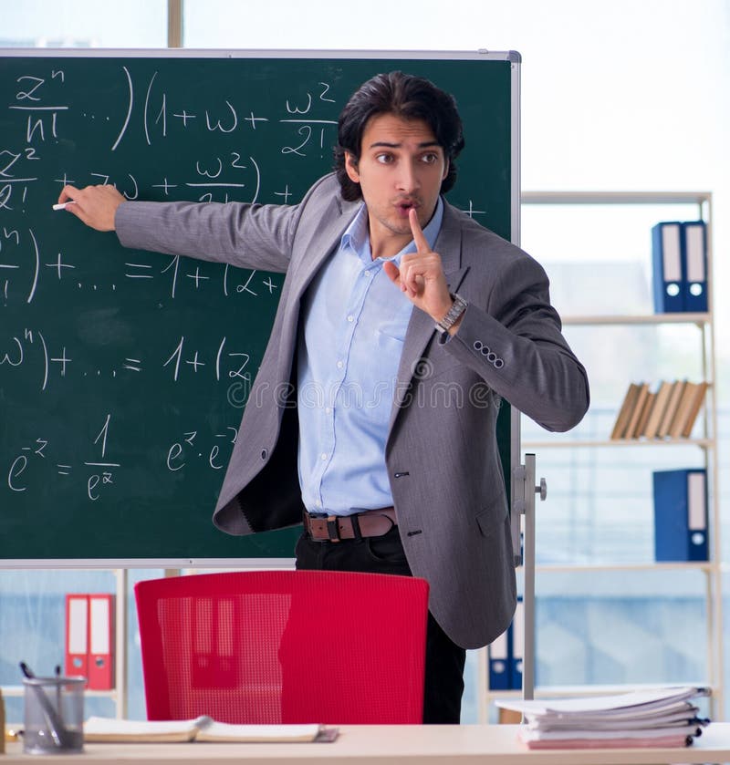 Young Handsome Math Teacher in Classroom Stock Photo - Image of class ...