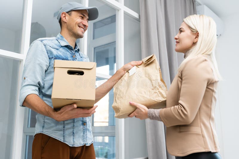 Young Handsome Man Delivering Box. Stock Image - Image of attractive ...
