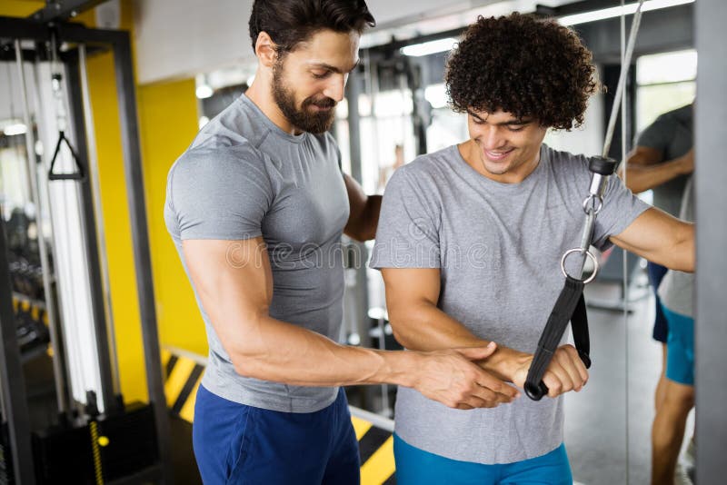 Young Handsome Man Working with Help from Instructor Stock Image ...
