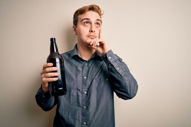 Young Handsome Redhead Man Drinking Bottle of Beer Over Isolated White ...