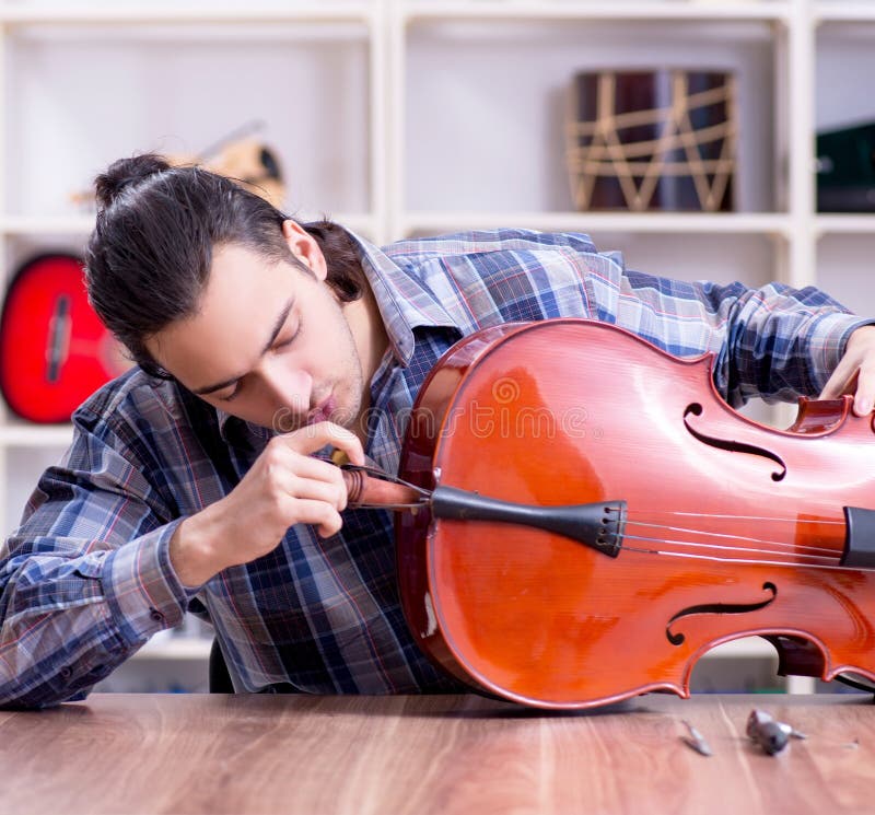 Young Handsome Repairman Repairing Cello Stock Image - Image of hobby ...