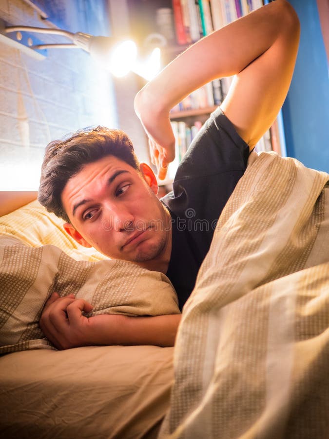 Young Handsome Sleepy Man in Bed Waking Up Stock Photo - Image of young ...