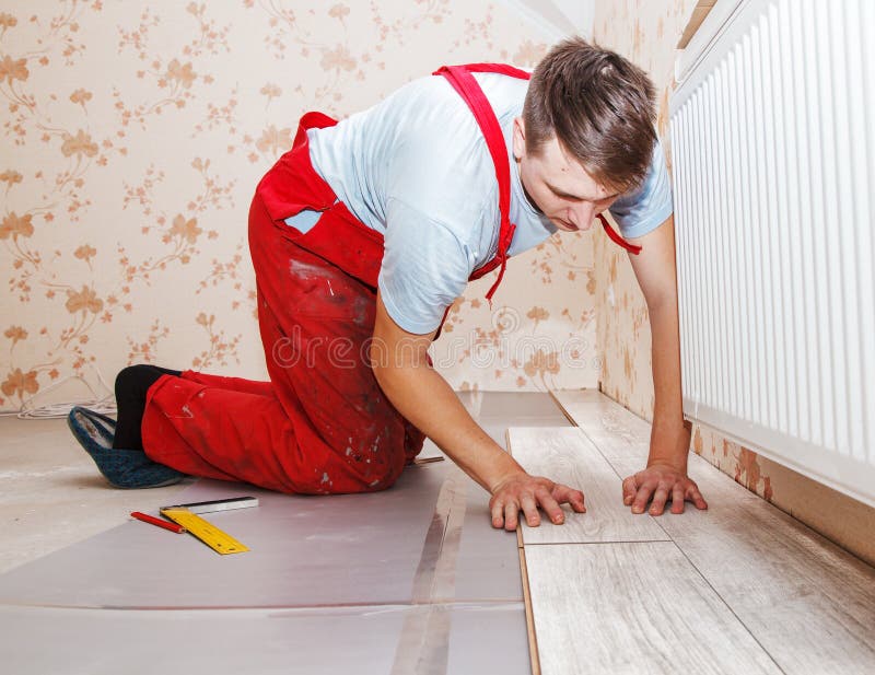 Young Handyman Installing Wooden Floor Stock Photo - Image of handyman ...