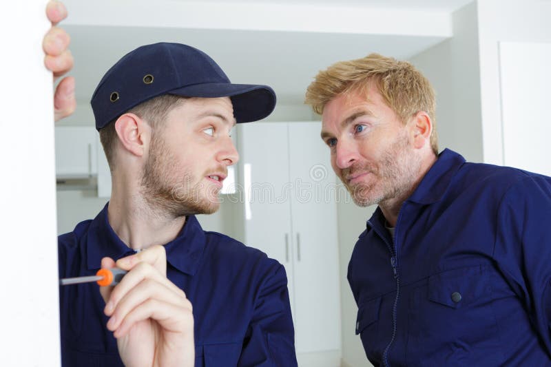 Young Handyman Supervised by Mentor Stock Image - Image of construction ...