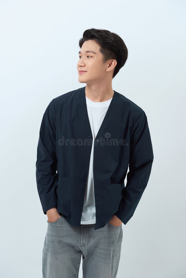 Young Happy Asian Man Standing Over White Wall. Looking at Camera Stock ...