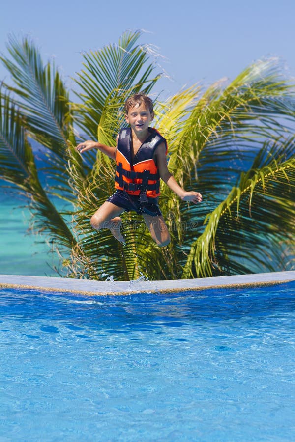 Young Happy Boy Jumping in Swimming Pool Stock Image - Image of ...