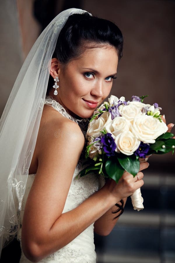 Young Happy Bride With Flowers Stock Photo - Image of marriage, bouquet ...