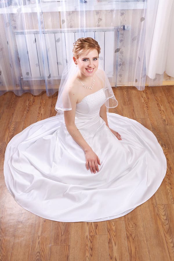 Smiling Bride Setting the Garter Stock Photo - Image of fianc ...