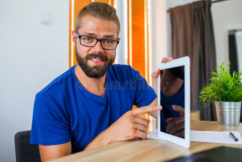 Young Happy Businessman Sitting Behind Table with Tablet Pc in H Stock ...