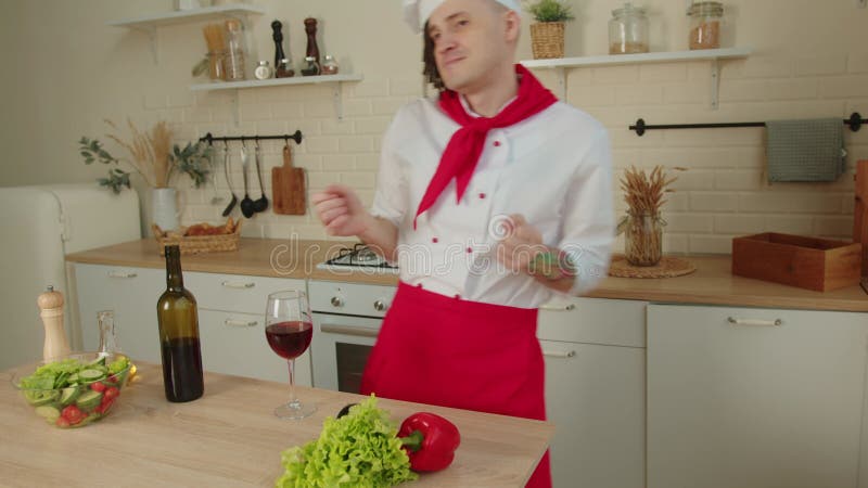 Young Happy Chef with Dreadlocks in Uniform Dancing in Kitchen ...