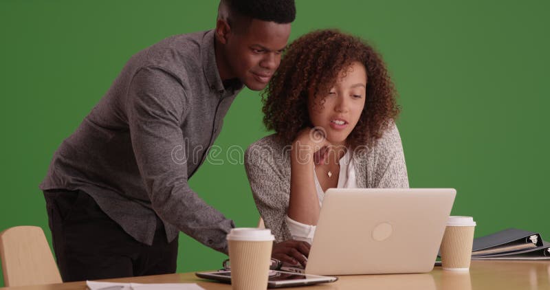 Young Happy Co-workers Using a Computer on Green Screen Stock Video ...