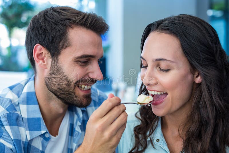 Young Happy Couple Feeding Each Other with Cake Stock Image - Image of ...