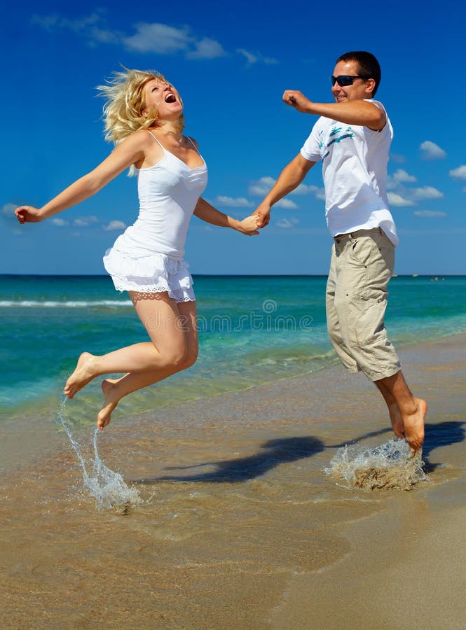 Young Happy Couple Having Fun on Sea Beach Stock Image - Image of adult ...
