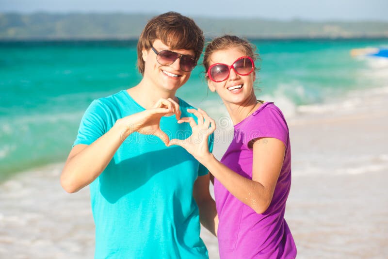 Young Happy Couple Having Fun on Tropical Beach. Stock Photo - Image of ...