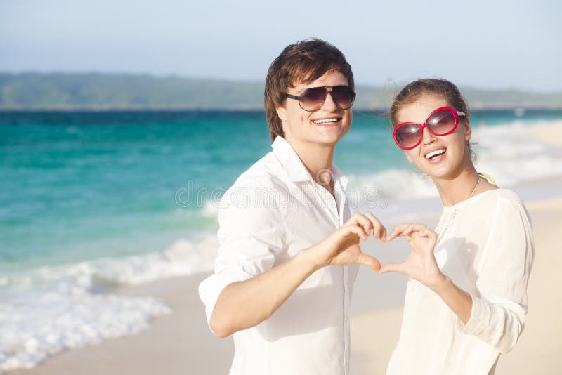 Young Happy Couple Having Fun on Tropical Beach. Stock Photo - Image of ...
