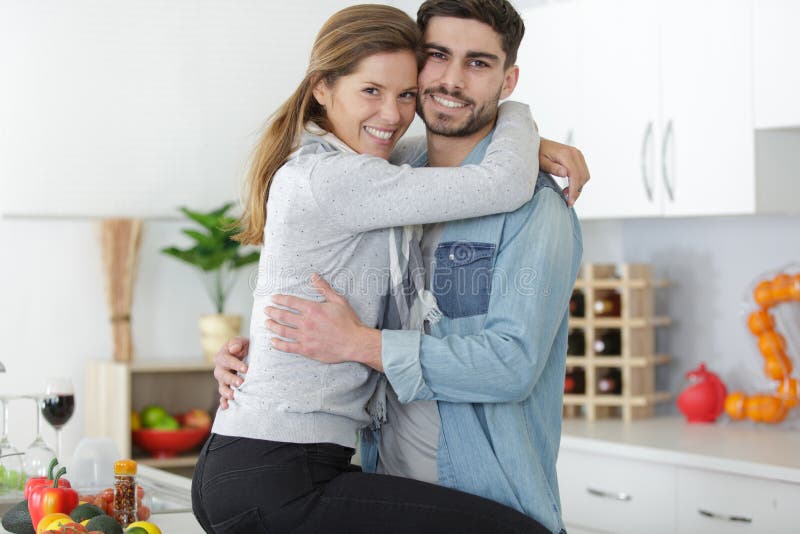Young Happy Couple Hugging in Kitchen in Morning Stock Photo - Image of ...