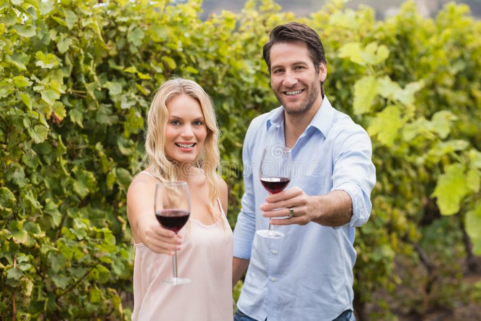 Young Happy Couple Offering Wine Stock Photo - Image of adult, handsome ...