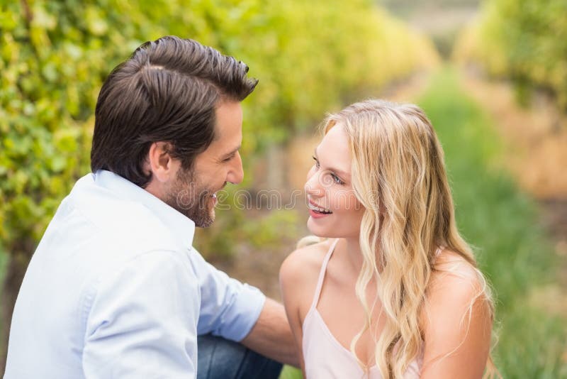 Young Happy Couple Smiling at Each Other Stock Photo - Image of sitting ...