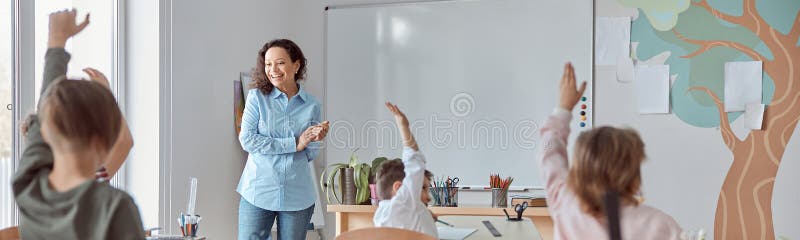 Young Happy Elementary School Pupils at Light Modern Classroom are ...