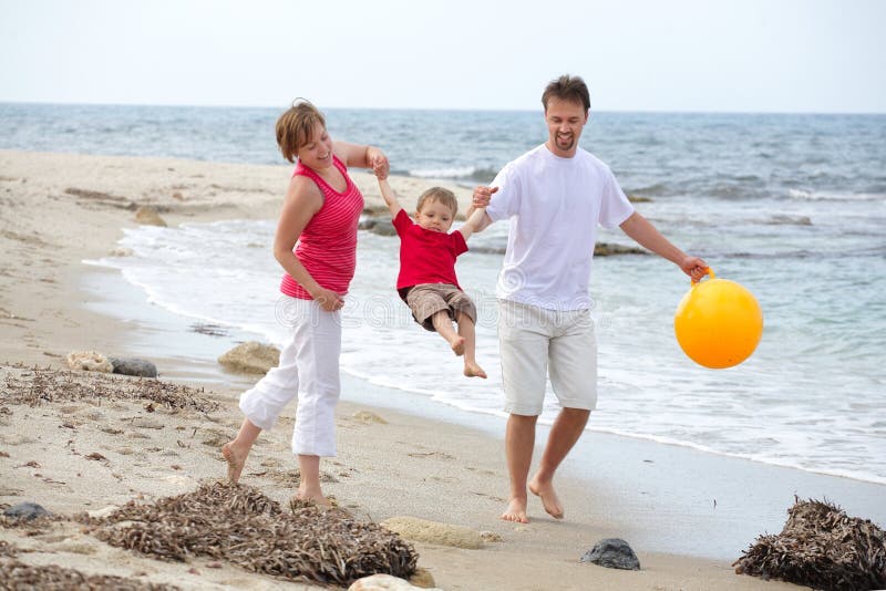 Happy Family Having Fun on the Beach. Stock Image - Image of energetic ...