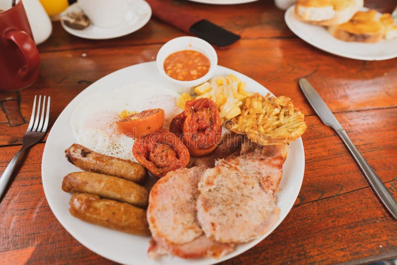 Young Happy Family Having Breakfast Stock Image - Image of juice ...