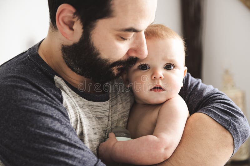 A Nice and Protect Father with Baby on Bed Stock Photo - Image of care ...