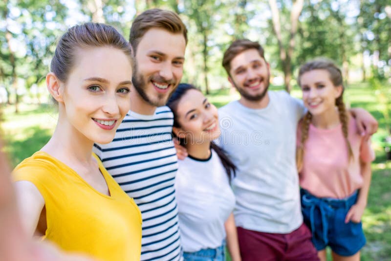 Young Happy Friends Taking Selfie Together in Park Stock Photo - Image ...