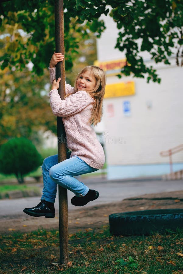 Young Happy Girl Climbing The Pole Stock Image - Image of health ...