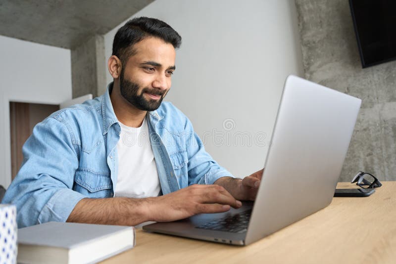 Young Happy Hispanic Businessman Working from Home Office Using Laptop ...