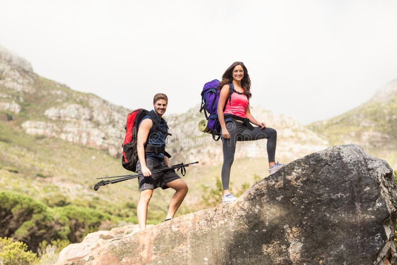 Young Happy Joggers Standing on Rock Stock Photo - Image of adventuring ...