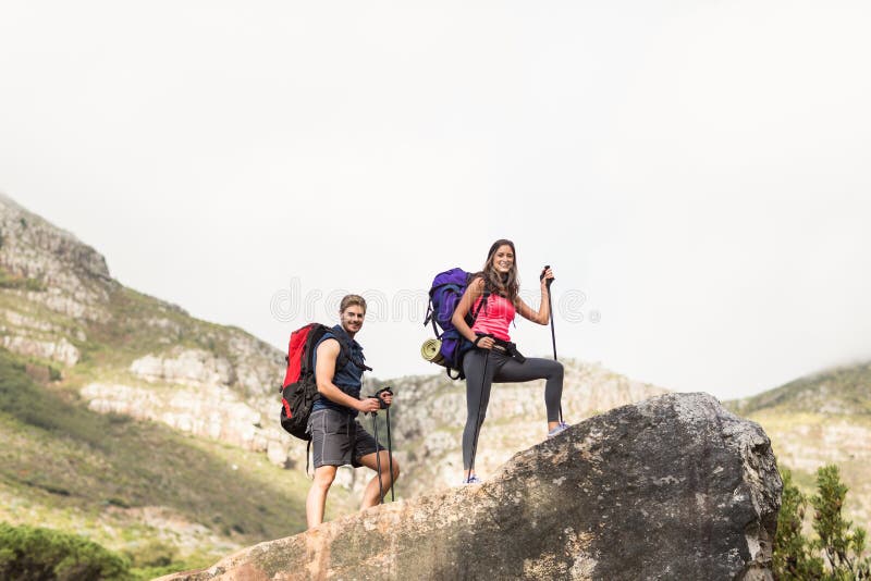 Young Happy Joggers Standing on Rock Stock Photo - Image of adventuring ...