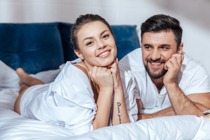 Young Happy Loving Couple in Bed Stock Image - Image of casual ...