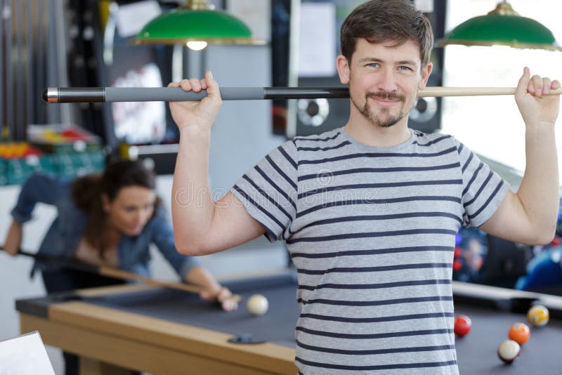 Young Happy Man Playing Billiard and Posing for Camera Stock Photo ...