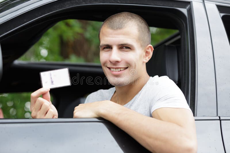 Young Happy Man Showing New Driver License Stock Photo - Image of ...