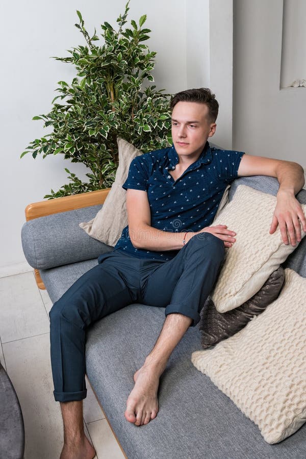 Young Happy Man Sitting on Couch. Relax Stock Image - Image of ...