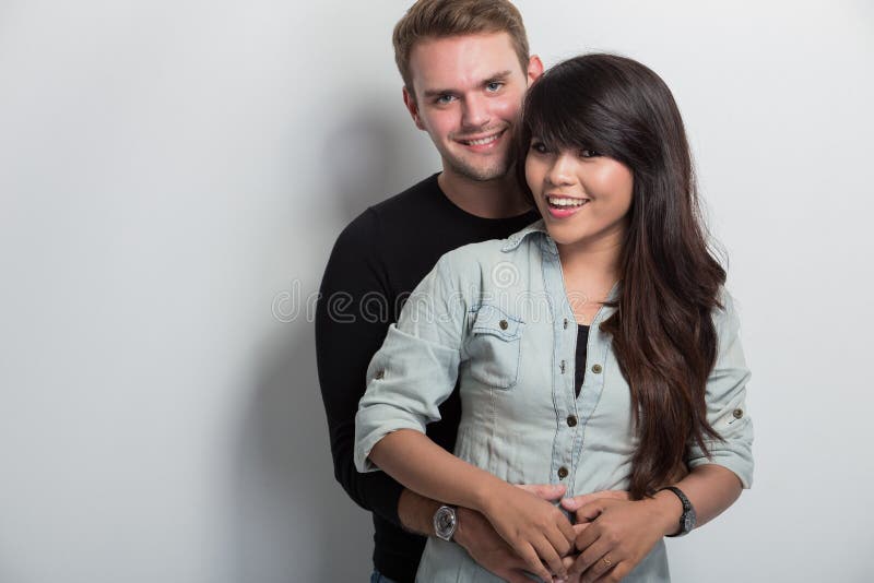 Young Happy Multicultural Couple Stock Image - Image of hold, lady ...