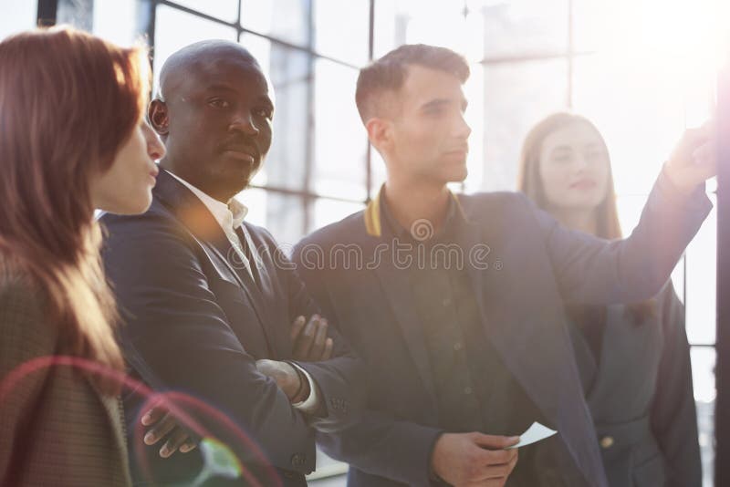 Creative Business Team Looking at Sticky Notes on Glass Window Stock ...
