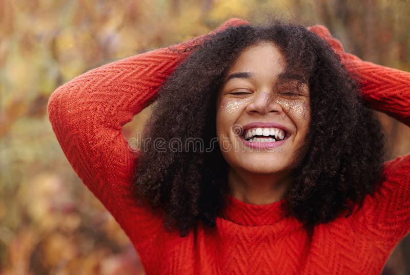 Young Happy Overjoyed Curly African American Woman With Eyes Closed And