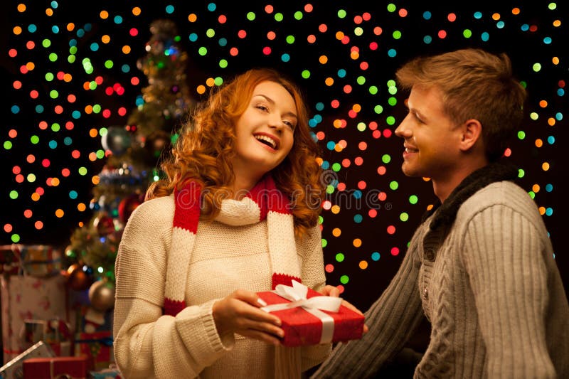 Young Happy Smiling Casual Couple Making a Present Stock Image - Image ...