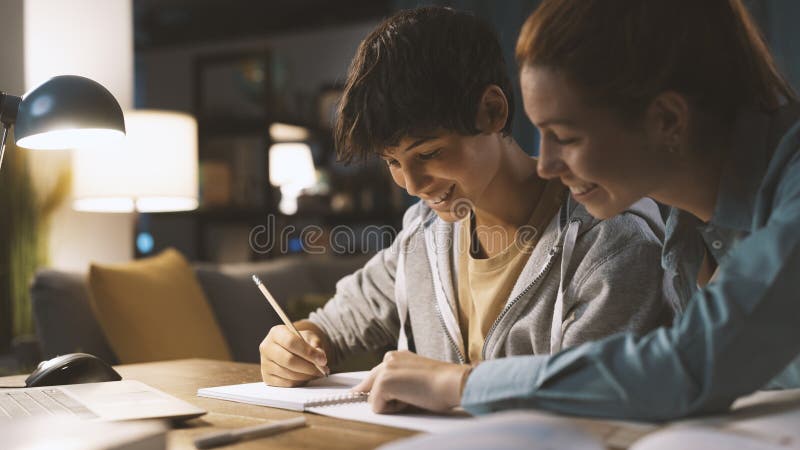 Students Doing Homework Together at Home Stock Image - Image of ...