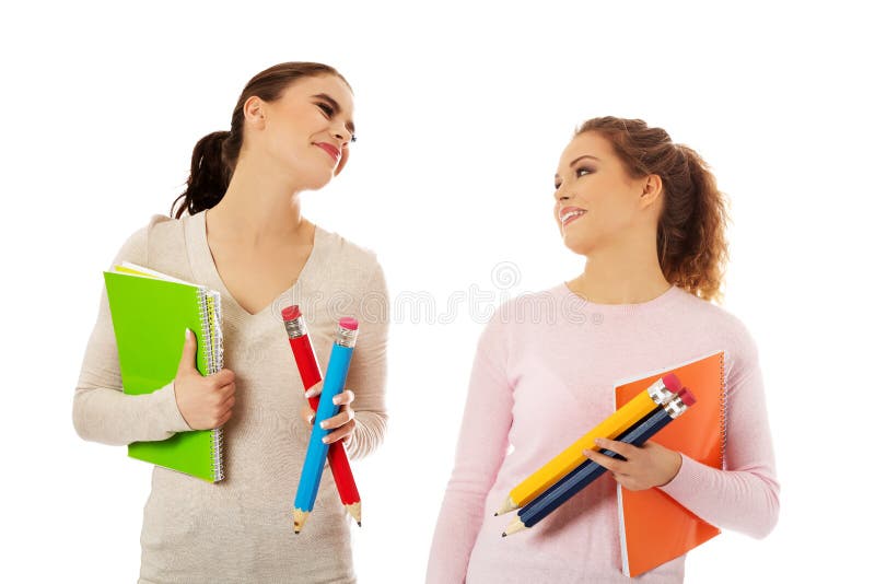 Young Happy Students Posing Over White Background. Stock Image - Image ...