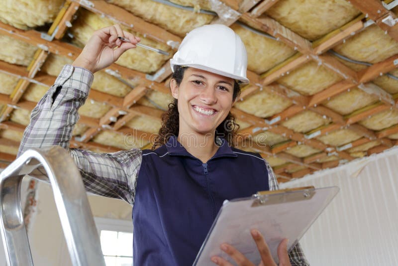 Young happy woman builder stock image. Image of builder - 202747115