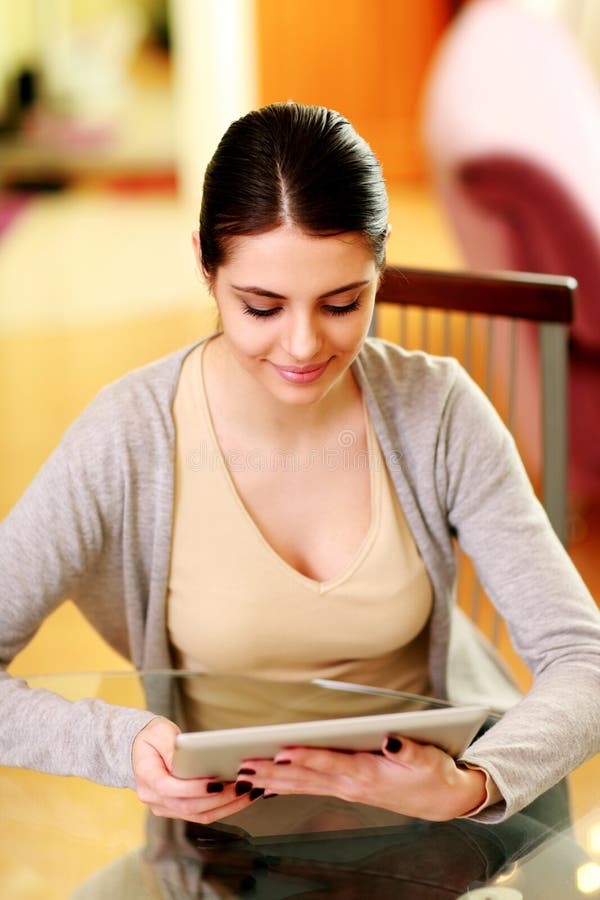 Young Happy Woman Looking at Tablet Computer Stock Image - Image of ...