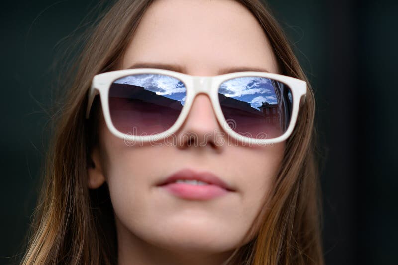 Young Happy Woman In Summer Clothes Sunglasses Posing Against The